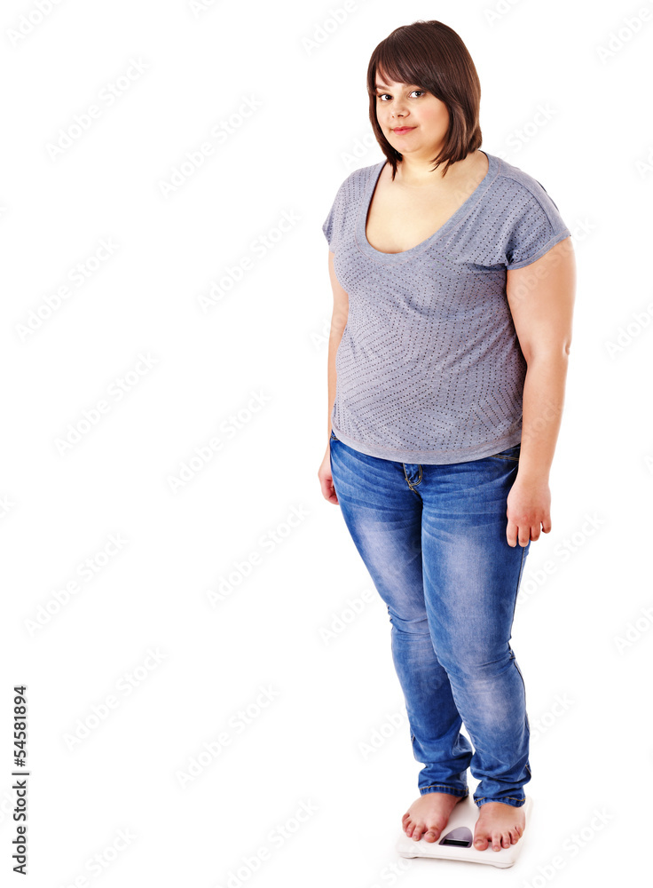 Fat girl on scales. Stock Photo | Adobe Stock