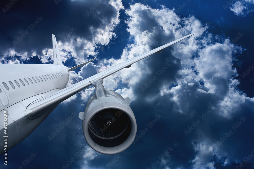 airplane flying down Stock Photo | Adobe Stock