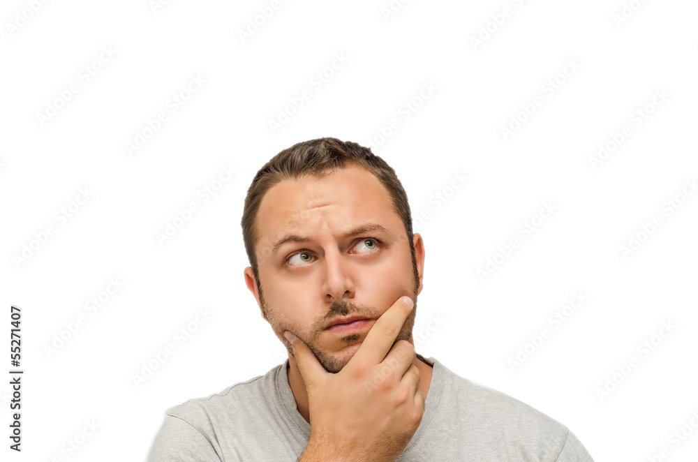 Uomo dubbioso su sfondo bianco Photos | Adobe Stock