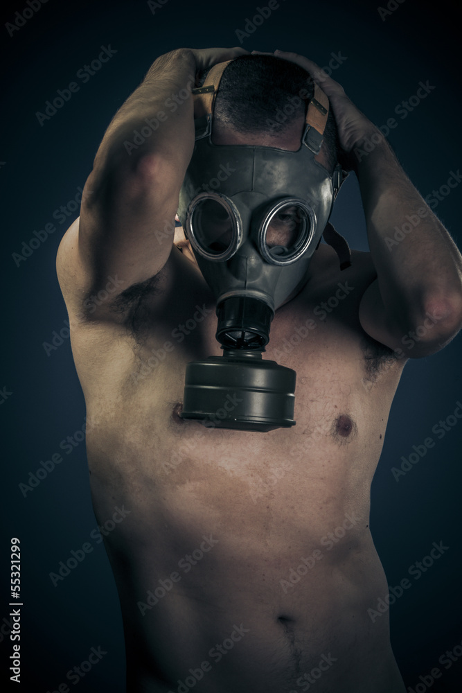 Foto de Toxic concept, nude man with gas mask do Stock | Adobe Stock