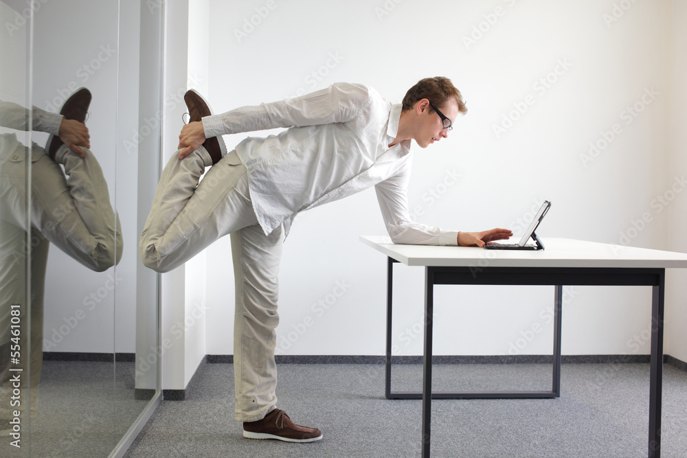 leg stretching in office work Stock-Foto | Adobe Stock