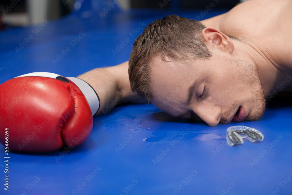 Defeated boxer. Close-up of defeated boxer lying down on the box Stock ...