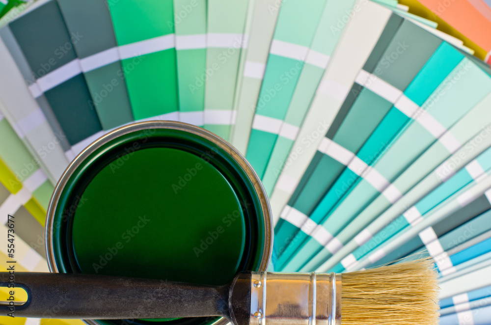Samples with different shades of green and can of green paint. Stock ...