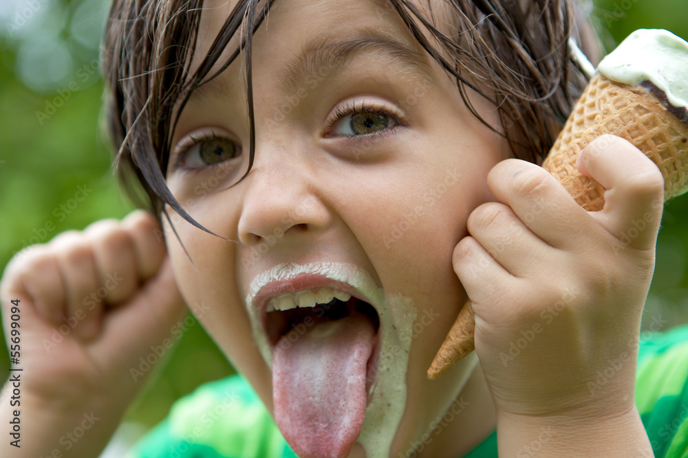 Young boy making a silly face with his ice cream Stock Photo | Adobe Stock