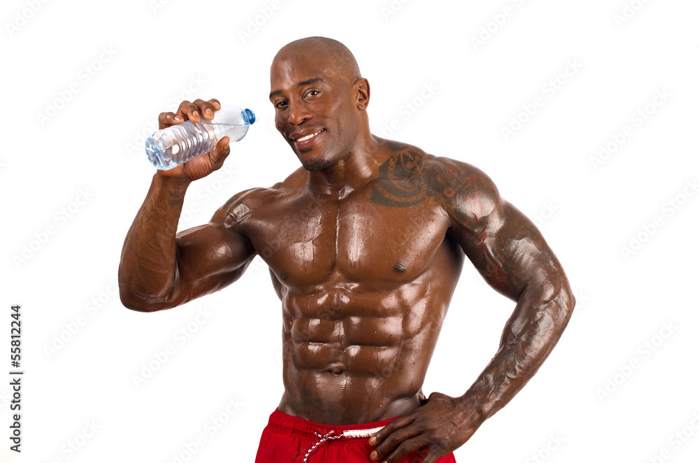Black bodybuilder drinking water after a hard workout Stock Photo ...