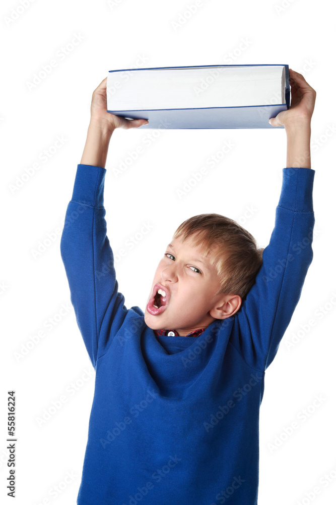 Angry blond boy throwing a big book on the floor Stock Photo | Adobe Stock