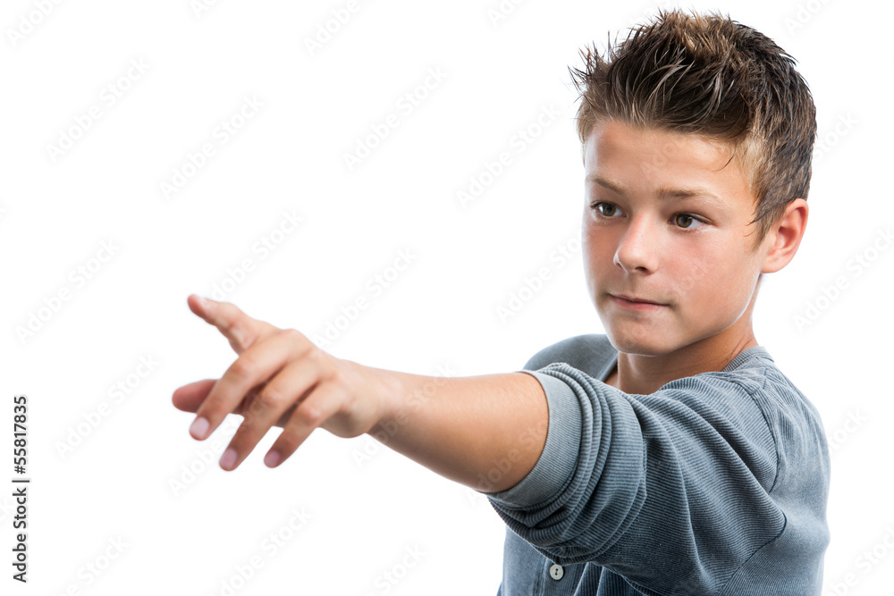Cute boy pointing into the distance with finger. Stock Photo | Adobe Stock