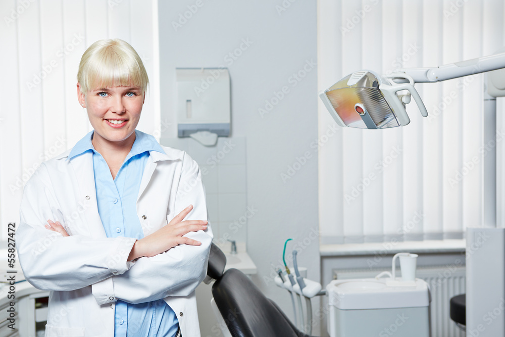 Female dentist with arms crossed in dental practice Stock Photo | Adobe ...