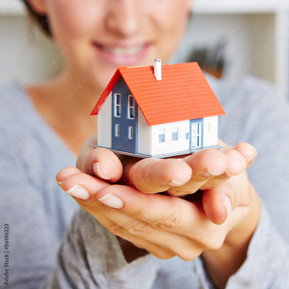 Hands holding a little house Stock Photo | Adobe Stock