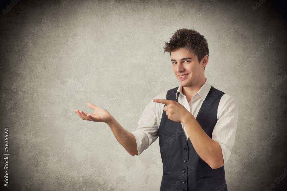 Young man pointing Stock Photo | Adobe Stock