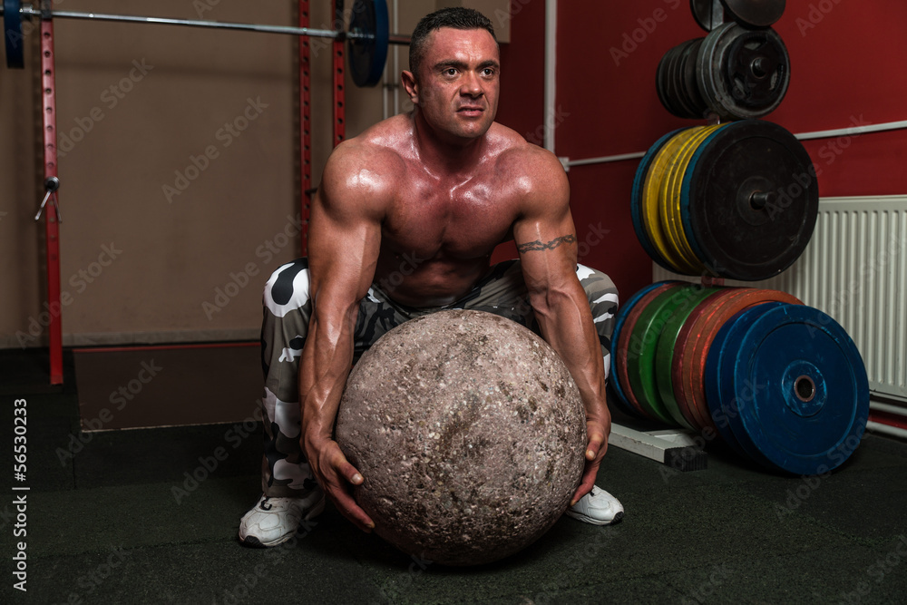 Bodybuilder Trying A Strongman Exercise Stock Photo | Adobe Stock