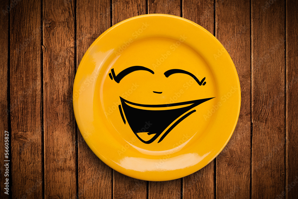 Happy smiley cartoon face on colorful dish plate Stock Photo | Adobe Stock