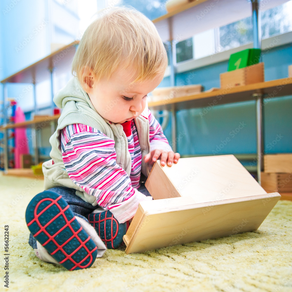 little girl in the classroom early development Stock Photo | Adobe Stock
