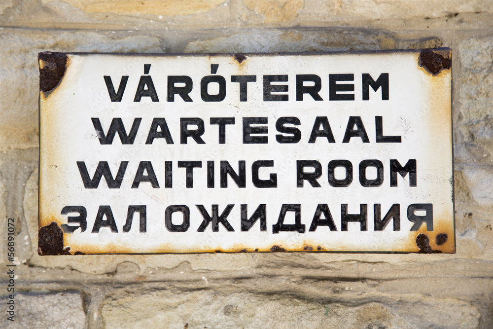 Waiting room sign, words on four languages Stock Photo | Adobe Stock