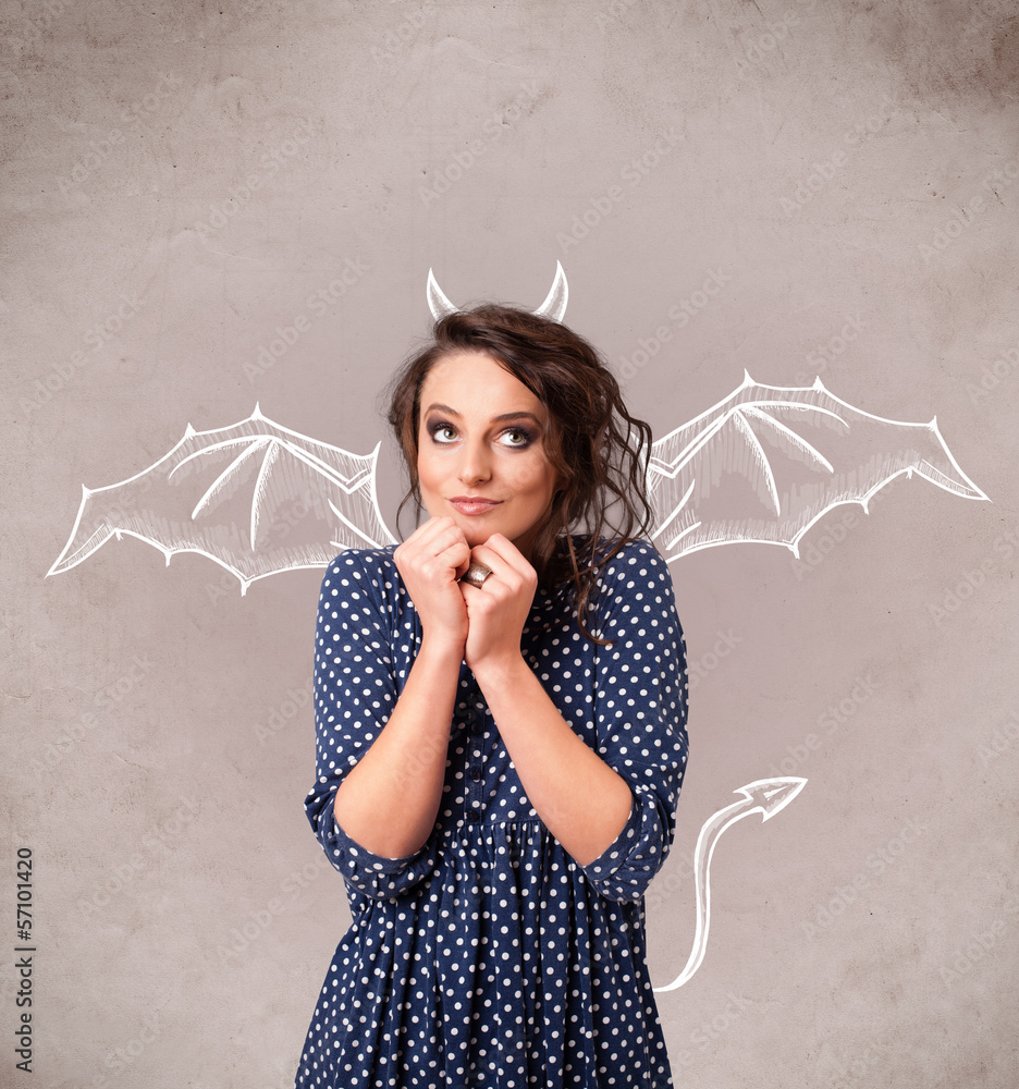 Young girl with devil horns and wings drawing Stock Photo | Adobe Stock