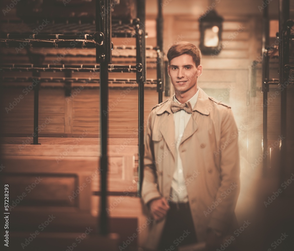 Handsome young man in coat inside vintage train coach Stock Photo ...