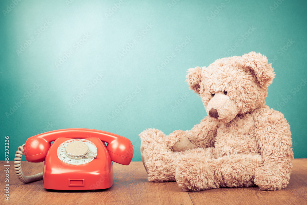 Retro red telephone and Teddy Bear near mint green wall Stock Photo ...