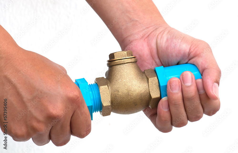 Bronze swing check valve and pvc pipe connection on hands. Stock Photo ...
