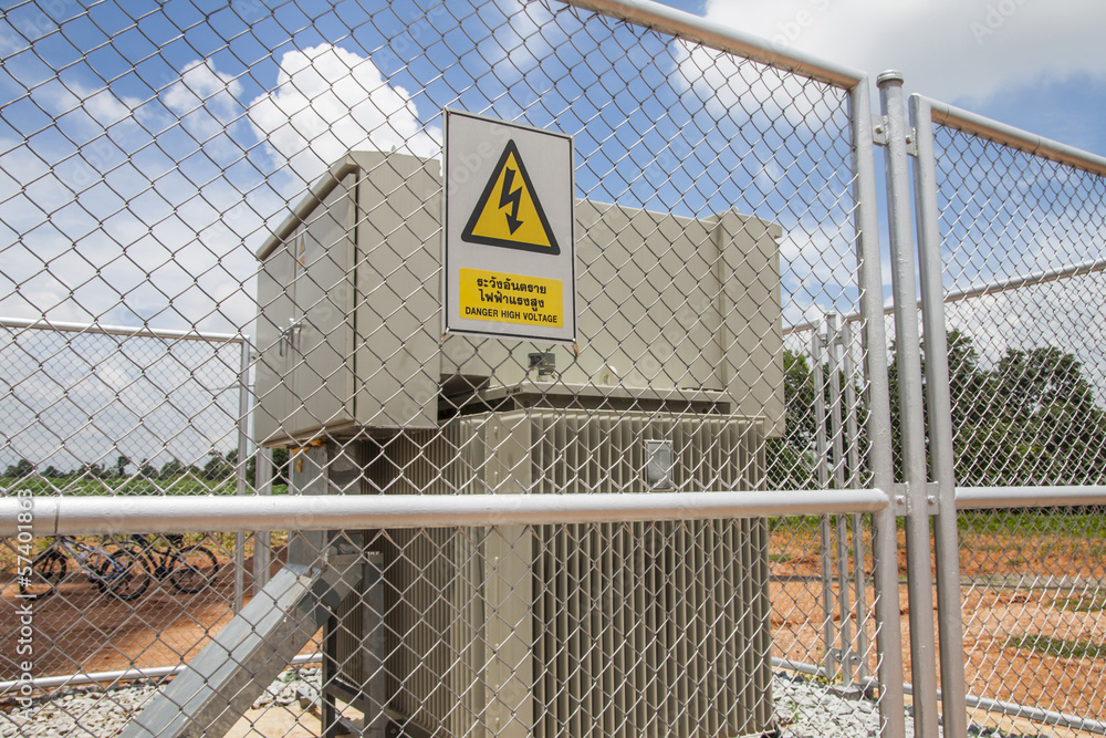 High-voltage device with aluminium fence and sign Stock Photo | Adobe Stock