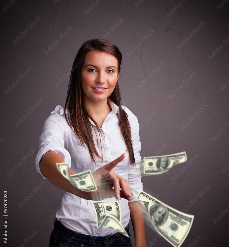 Young girl throwing money Stock Photo | Adobe Stock