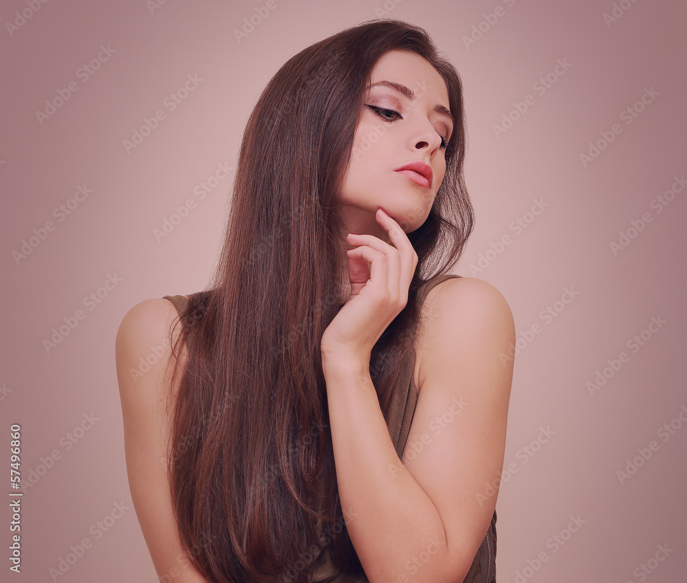 Sexy beautiful girl looking down with hand at face with long hai Stock Photo | Adobe Stock