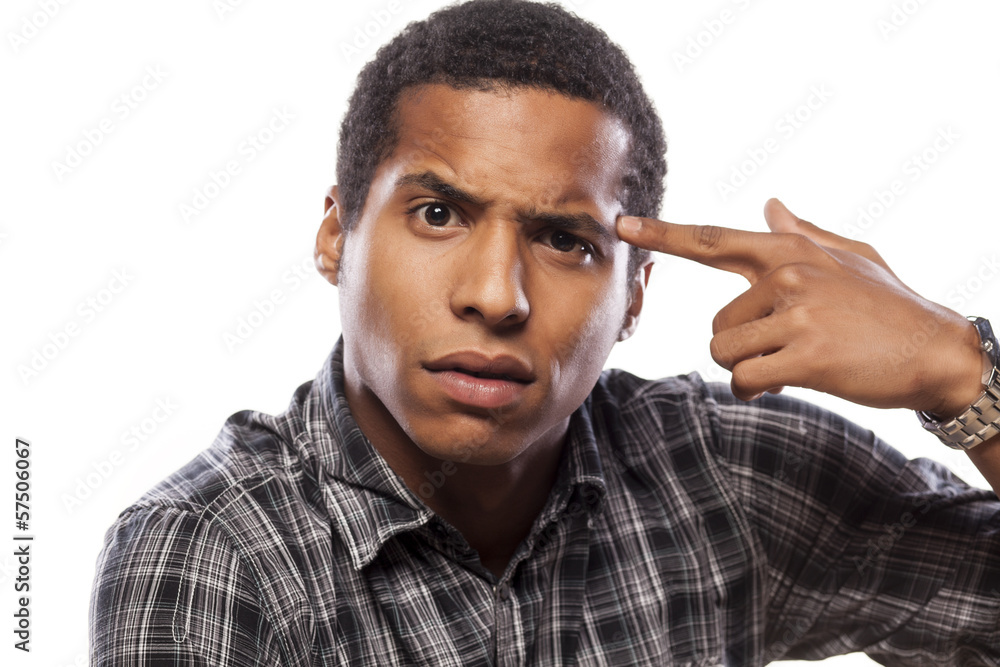 dark-skinned young man with a questioning expression Stock Photo ...