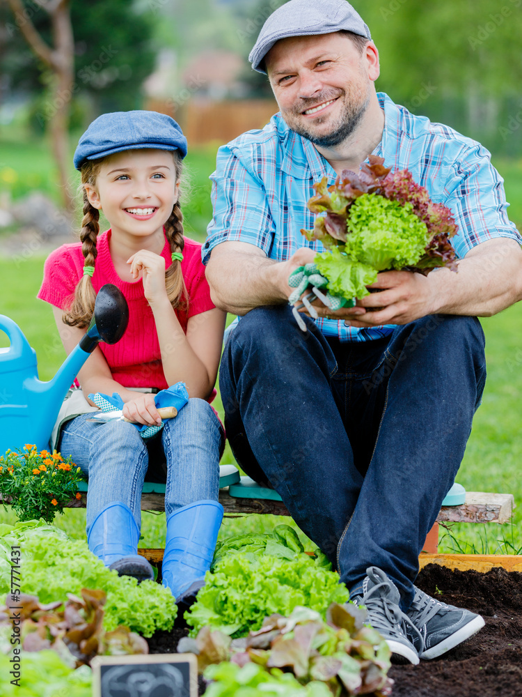 Gardening - lovely girl helping father in the garden Stock Photo ...