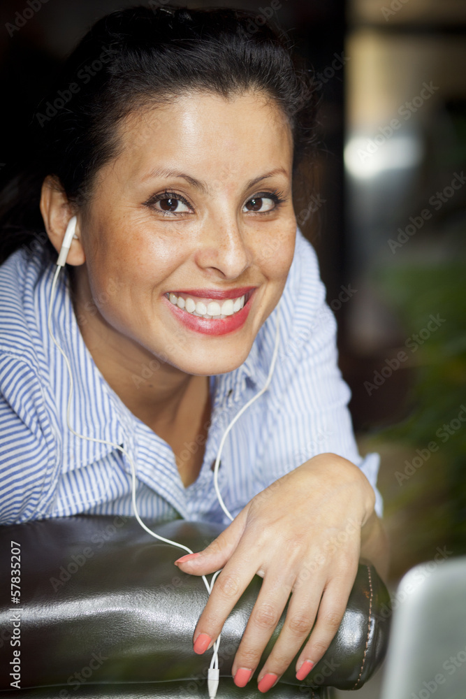 Smiling Spanish Woman Working On The Laptop At Home Stock Photo | Adobe ...