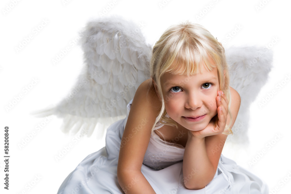 kleiner Engel schaut in die Kamera Stock-Foto | Adobe Stock