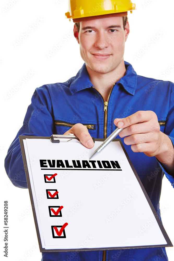 Construction worker holding evaluation checklist Stock Photo | Adobe Stock
