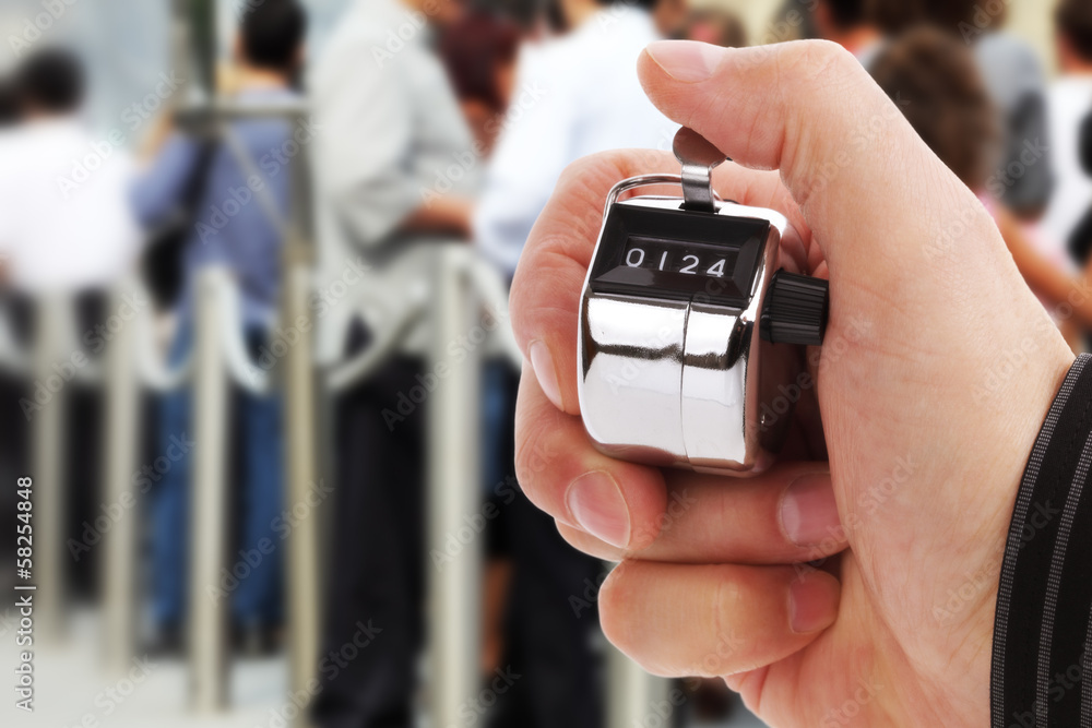 Counting people headcount on tally counter Stock-Foto | Adobe Stock