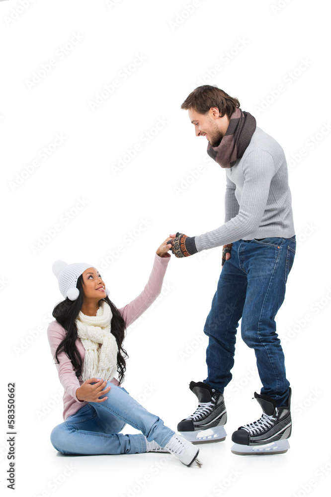 Careful man helping his girlfriend to stand up after falling Stock ...