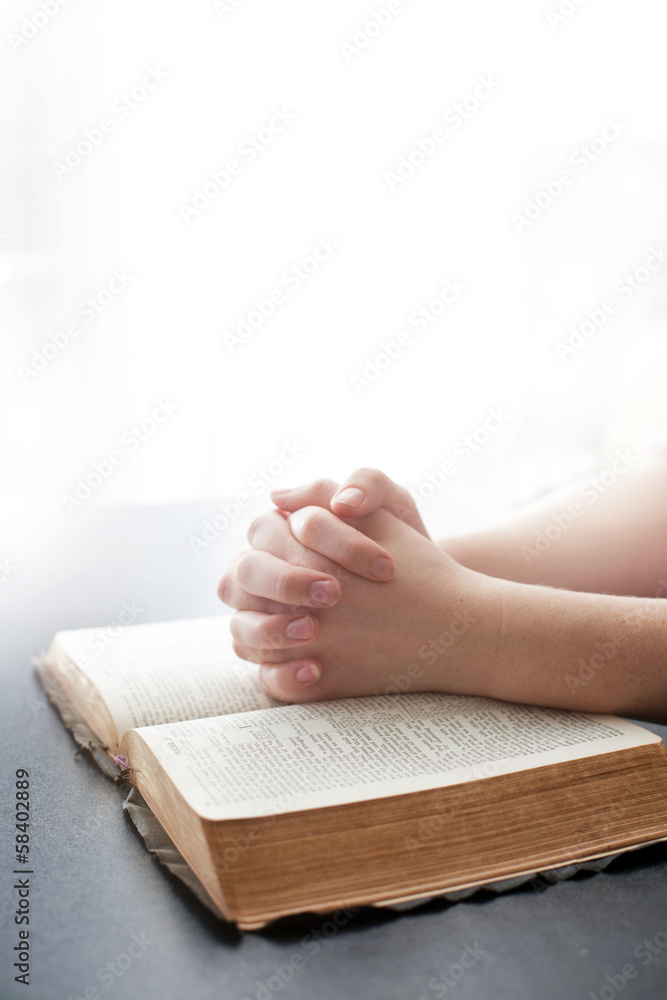 Woman praying on white background Stock Photo | Adobe Stock