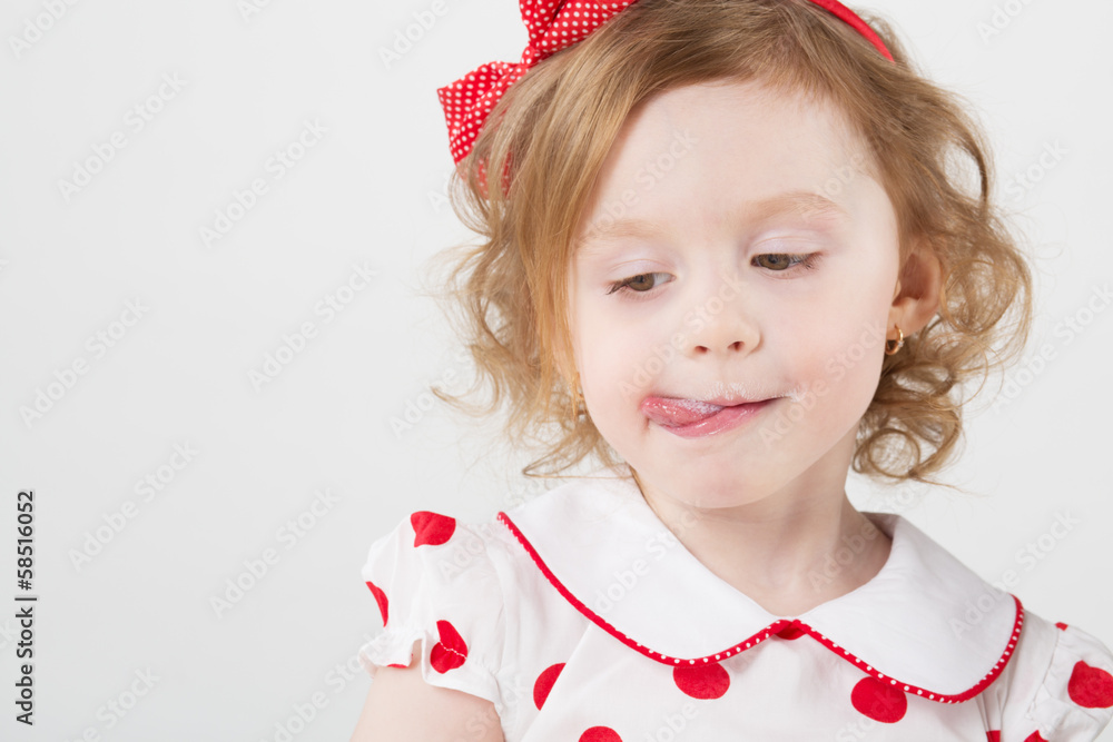 Poster Little girl licking her lips covered with milk – Wall Art ...