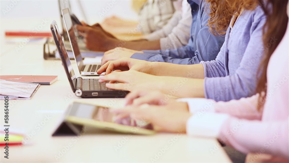 Students using computer in classroom Stock Video | Adobe Stock