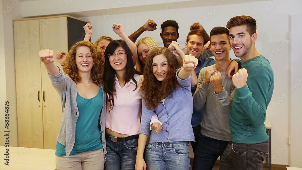 Students cheering in classroom Stock Video | Adobe Stock