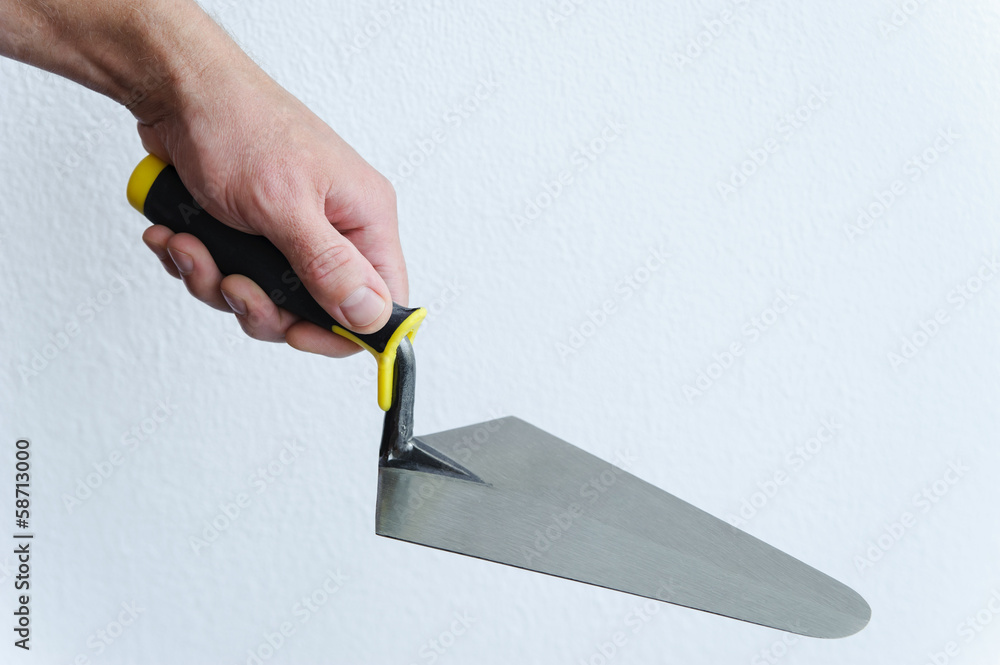 Hand with trowel Stock Photo | Adobe Stock