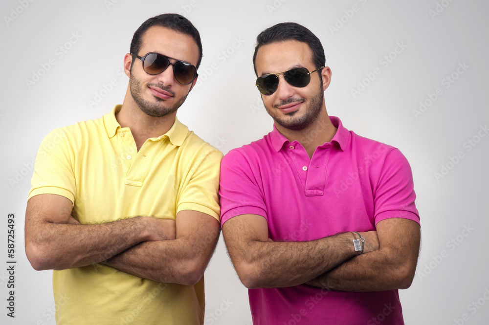 Identical twins portraits shot against white background Stock Photo ...