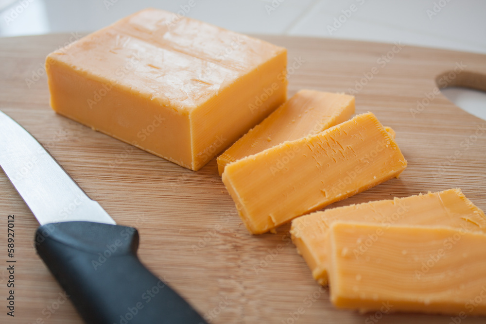 Cheddar Cheese Block and Slices Stock Photo | Adobe Stock