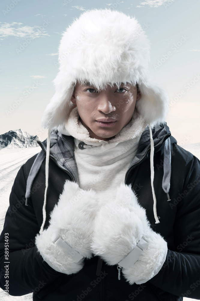 Asian winter fashion man in snow mountain landscape. Wearing bla Stock ...