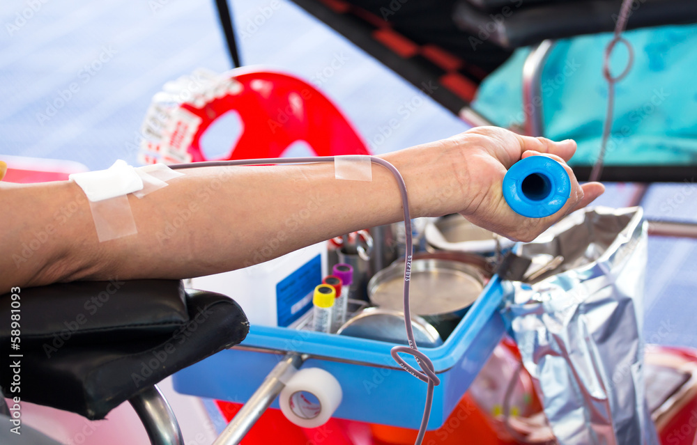 arm of a donor donating blood at hemotransfusion station Stock Photo ...
