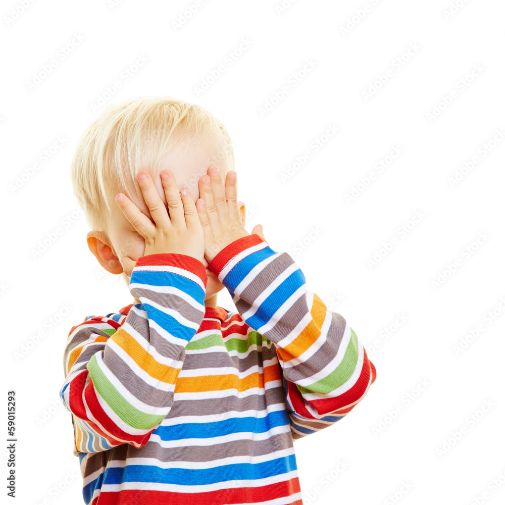 Kind hält sich die Augen zu Stock Photo | Adobe Stock