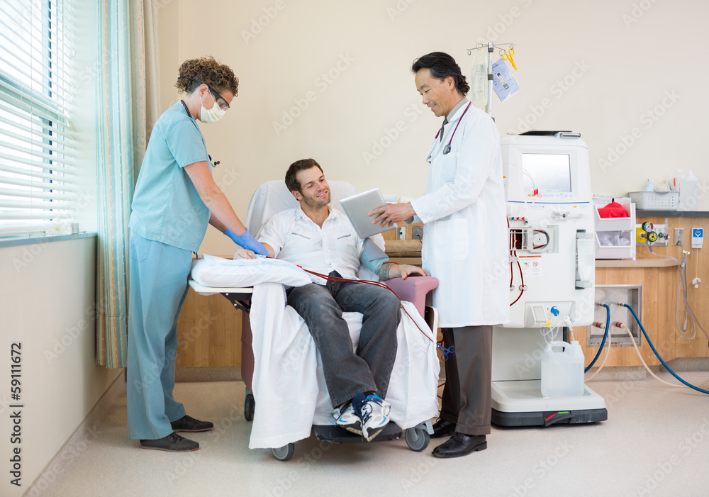 Doctor Showing Digital Chart to Dialysis Patient Stock Photo | Adobe Stock