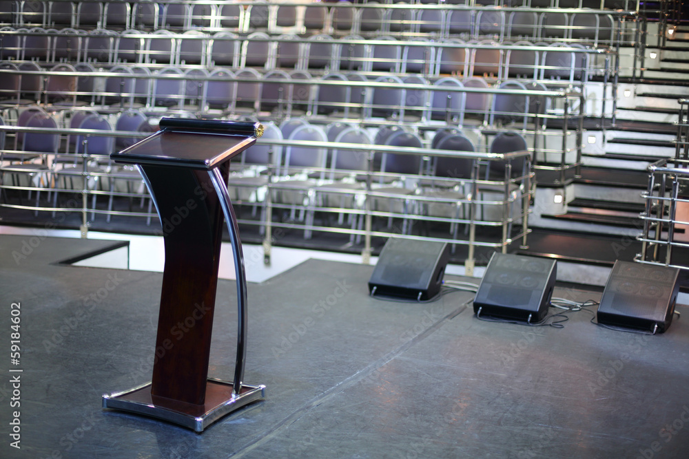 Document stand on black stage and rows of seats Stock Photo | Adobe Stock