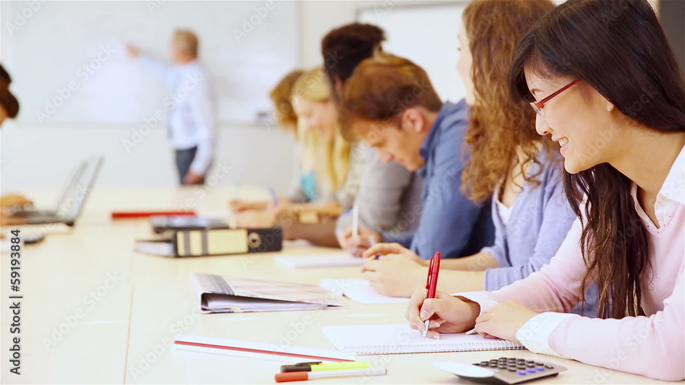 Teenager in classroom learning from teacher Stock Video | Adobe Stock