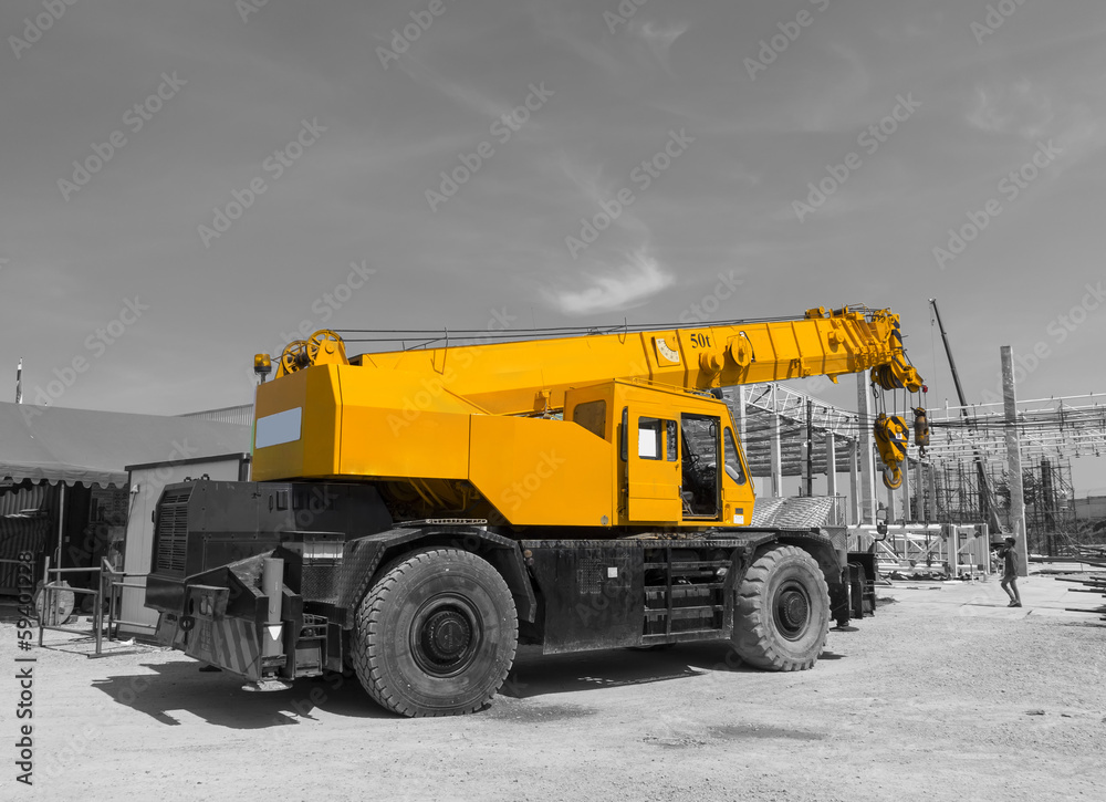 Mobile crane in construction site. Industrial machine equipment or ...
