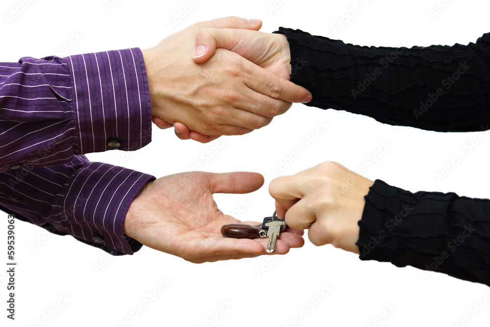 woman receiving a handshake and a house key at the same time Stock ...