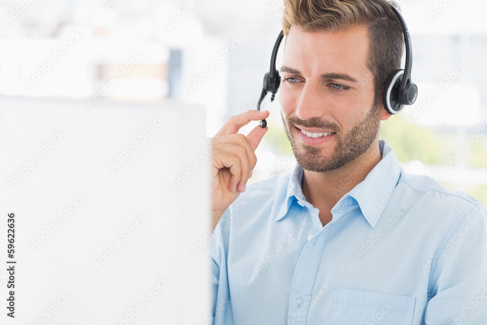 Close-up of a casual young man with headset using computer Stock-Foto ...
