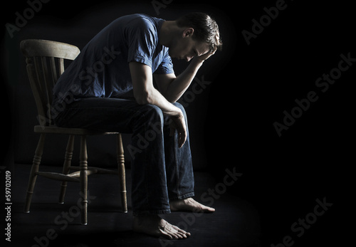 Sad Man Sitting In Chair