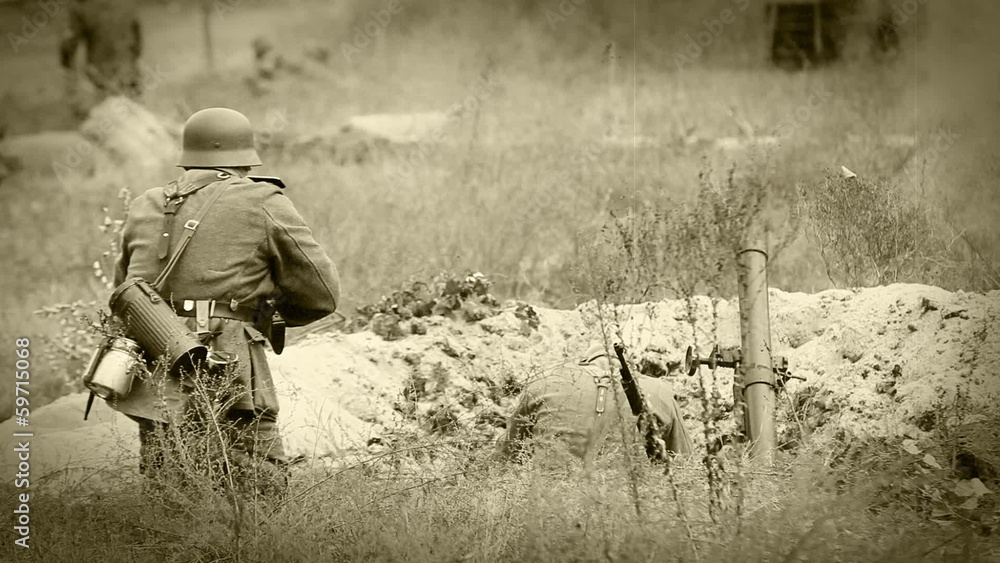 Nazi soldiers shooting with a rifle and mortar in trench . WWII Stock ...